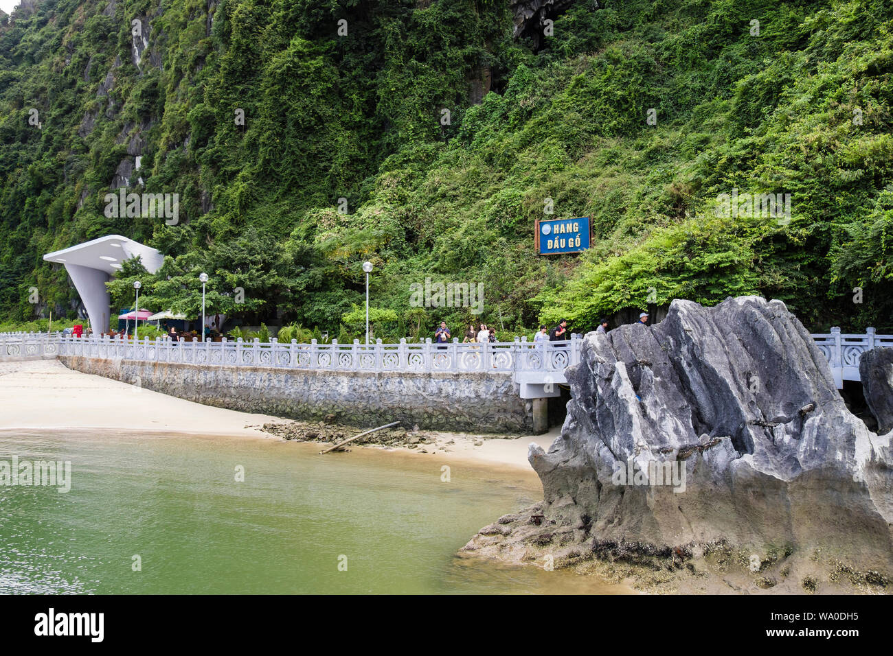 Walkway with tourists returning from visiting Hang Dau Go cave on Dau ...