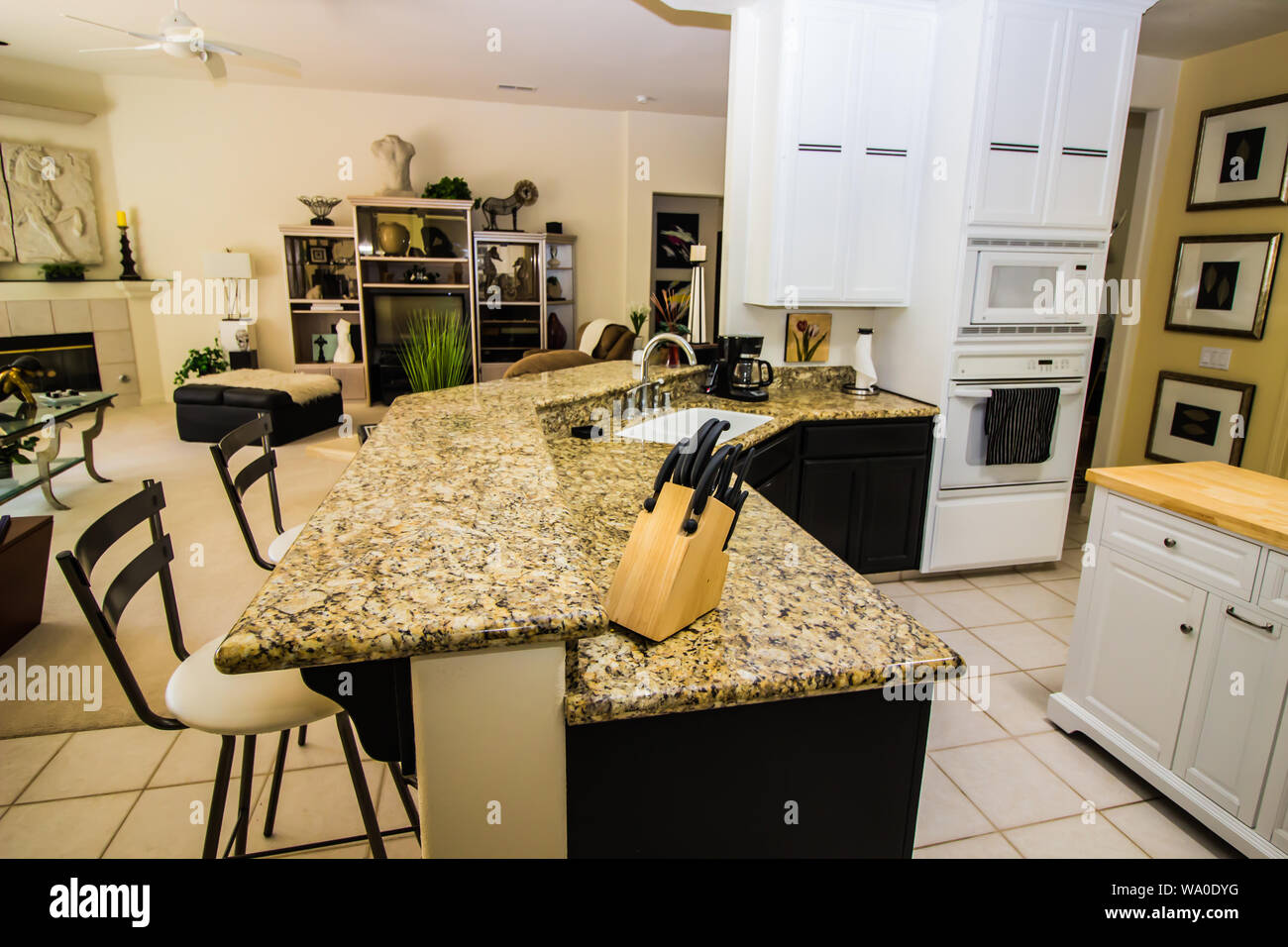 Modern Granite Kitchen Counter Bar And Open Living Room Stock Photo - Alamy