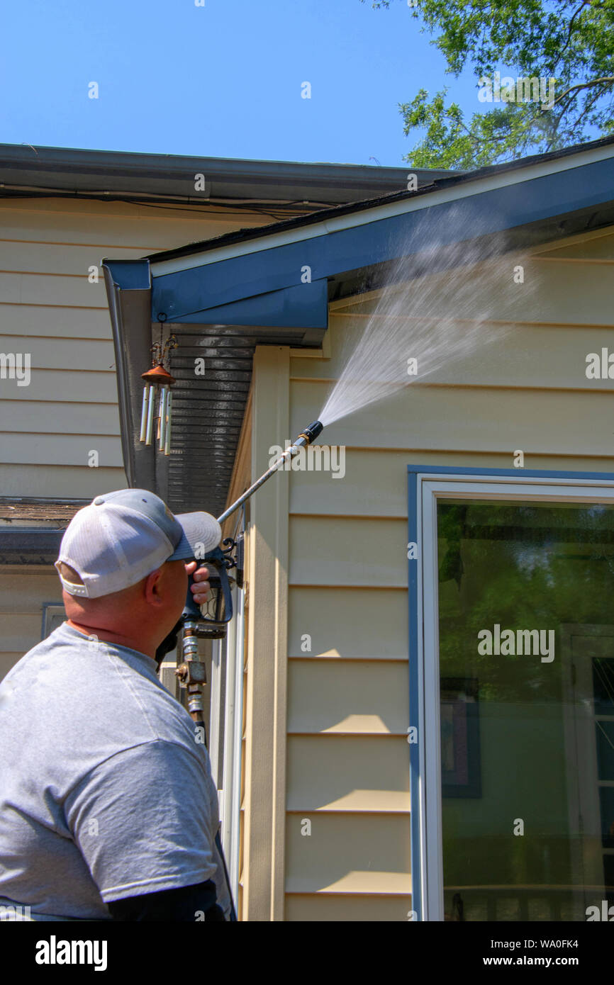 Man roof hose nozzle hi-res stock photography and images - Alamy
