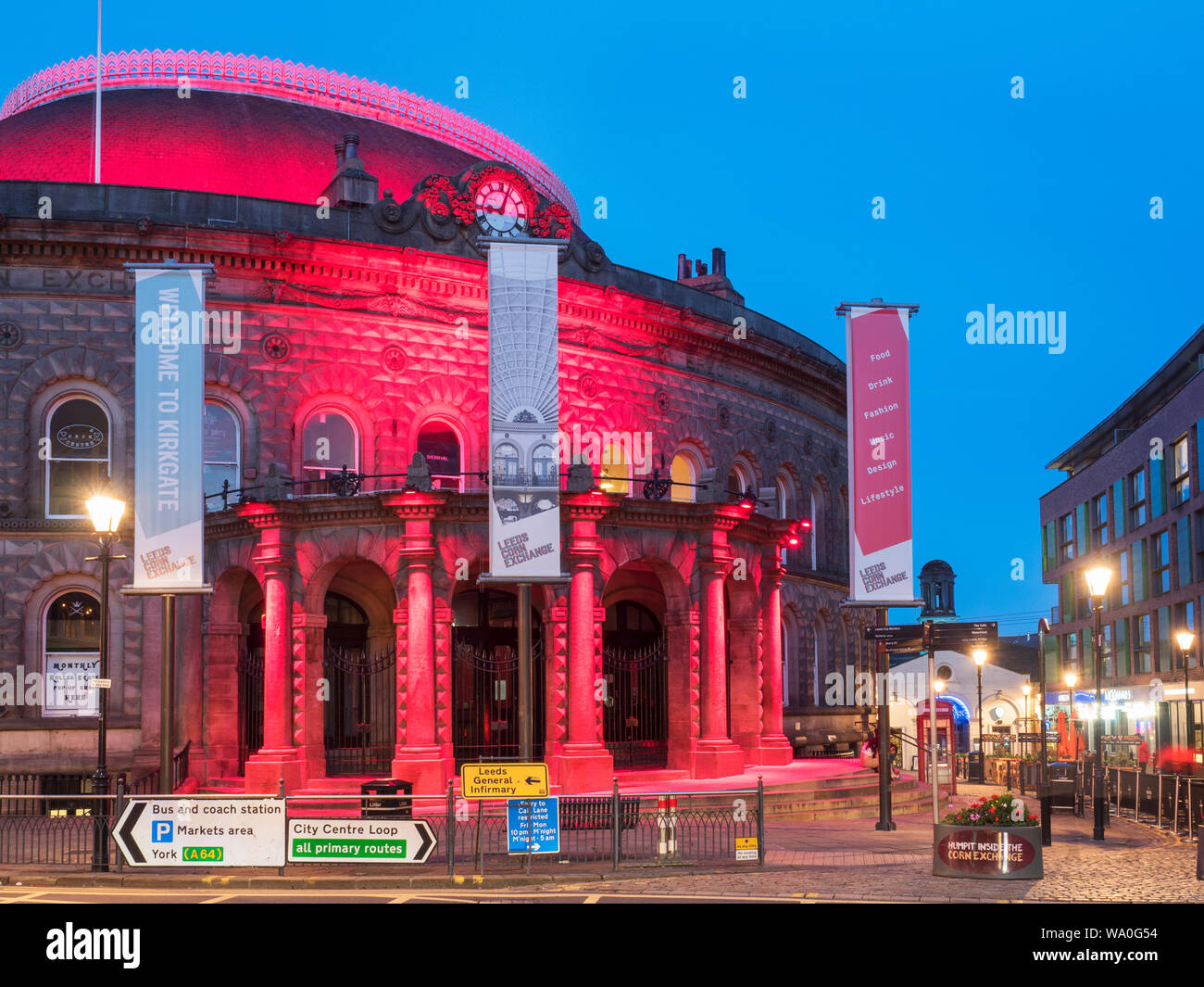 The Corn Exchange illuminated by red lights at dusk Leeds West ...
