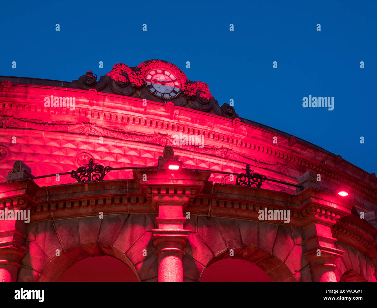 The Corn Exchange illuminated by red lights at dusk Leeds West ...