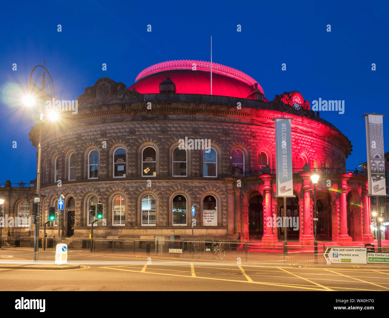 The Corn Exchange illuminated by red lights at dusk Leeds West ...