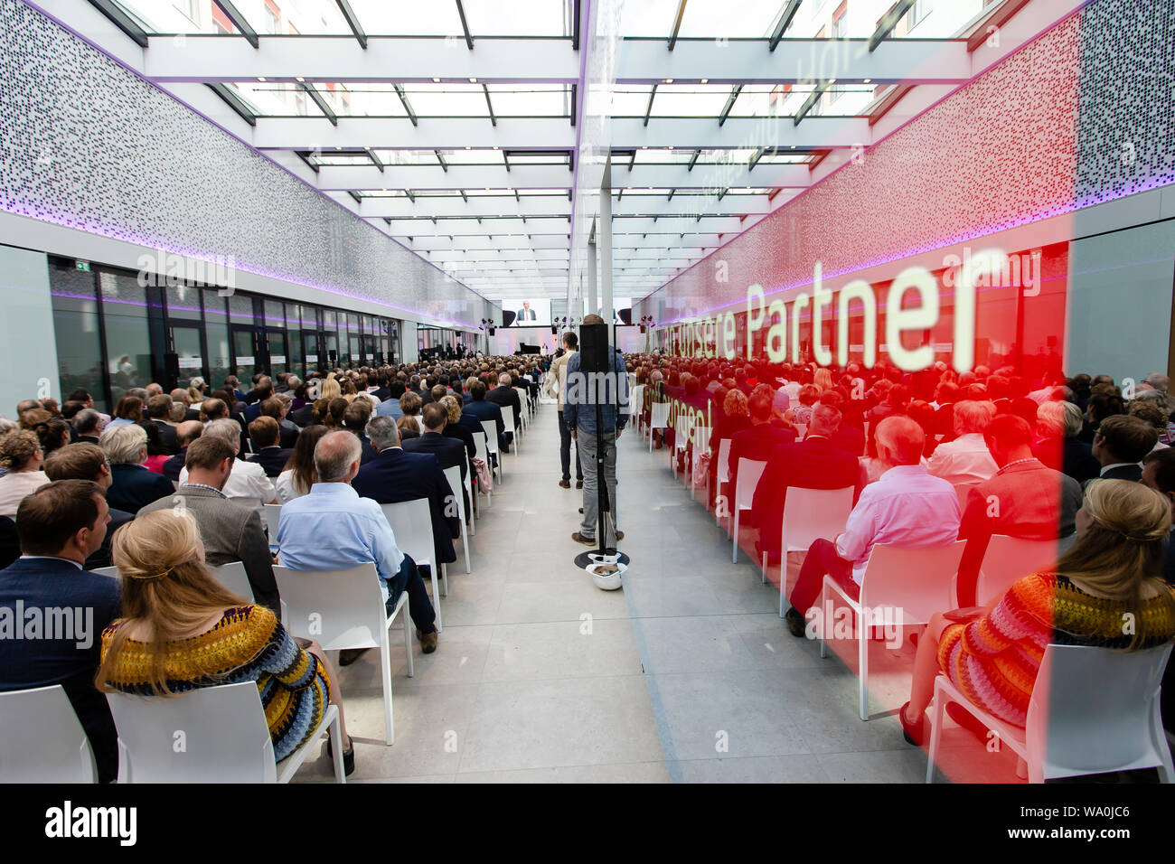 Kiel, Germany. 16th Aug, 2019. Guests are reflected in a glass pane in ...