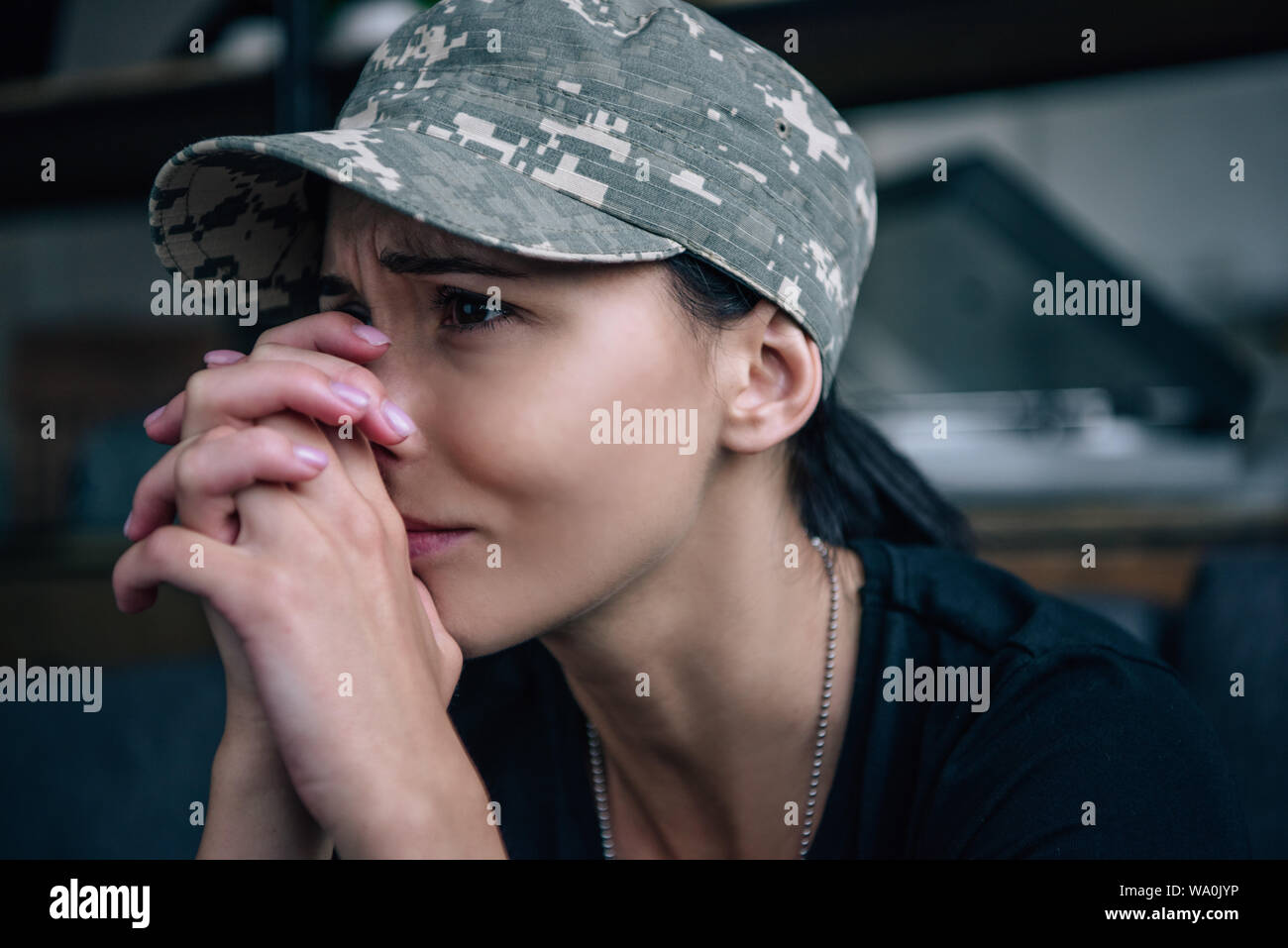 depressed woman in military uniform crying at home Stock Photo - Alamy