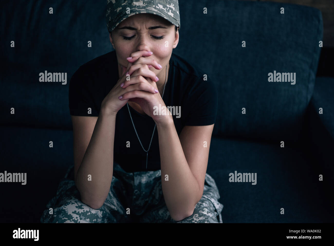 depressed woman in military uniform crying at home Stock Photo - Alamy