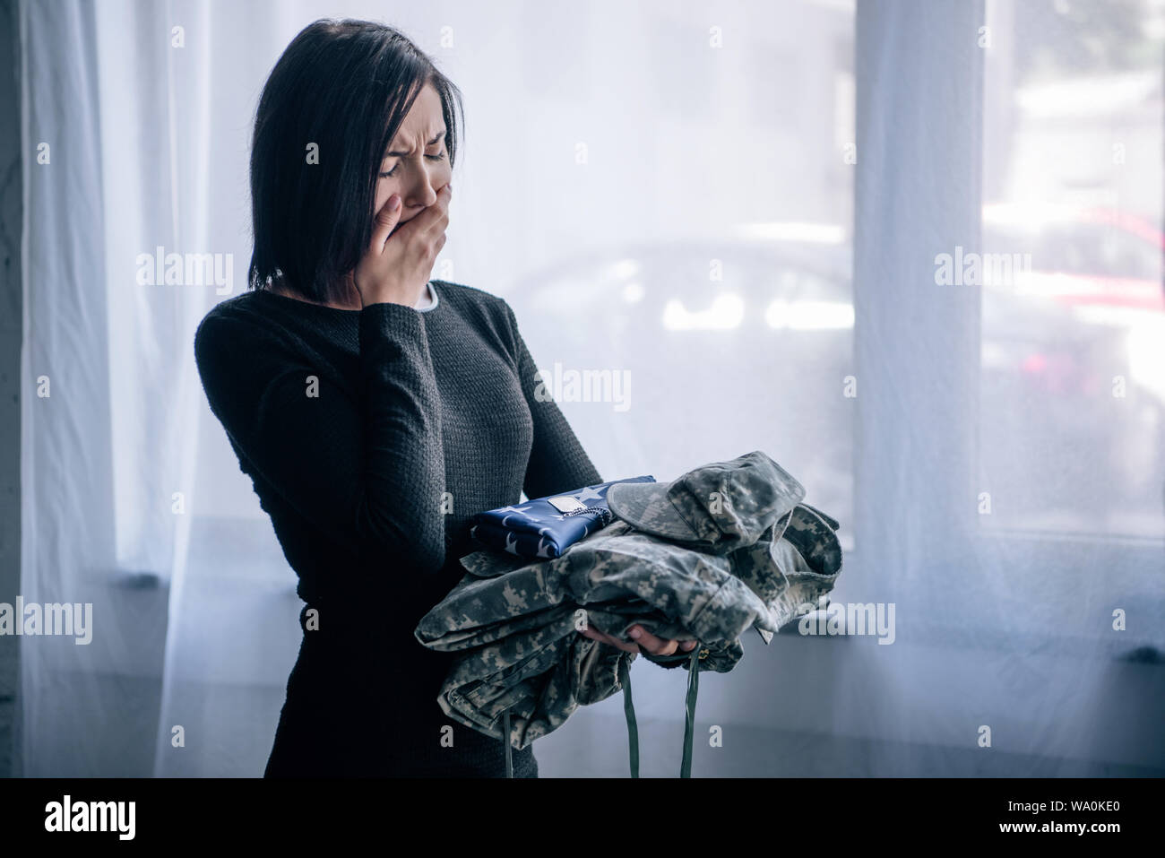 Woman crying holding american flag hi-res stock photography and images ...