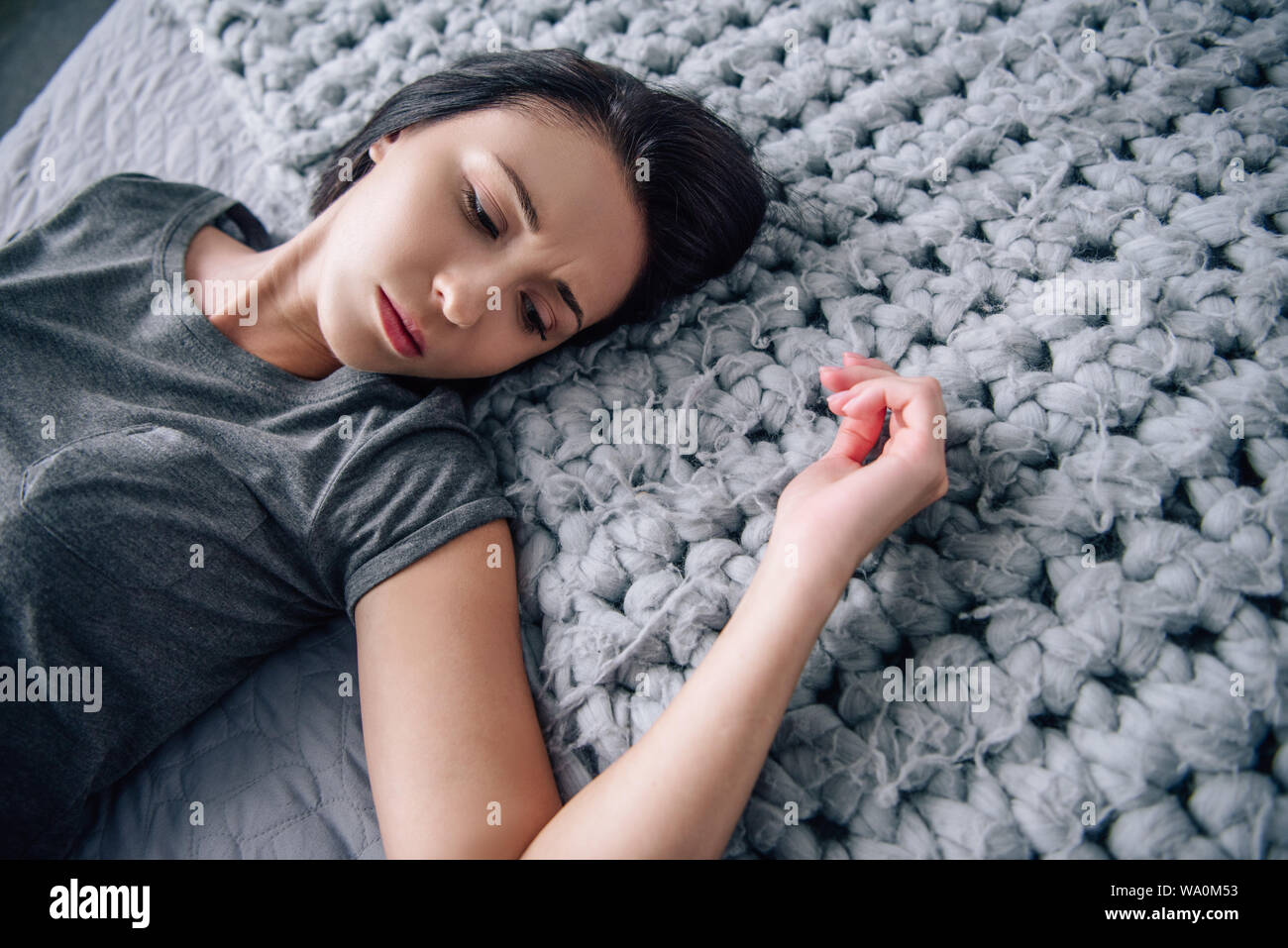 Lonely woman lying hi-res stock photography and images - Alamy