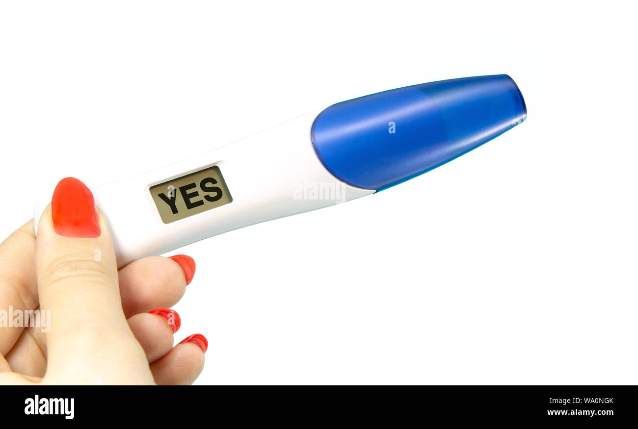 Woman hand holding digital pregnancy test isolated on white background ...