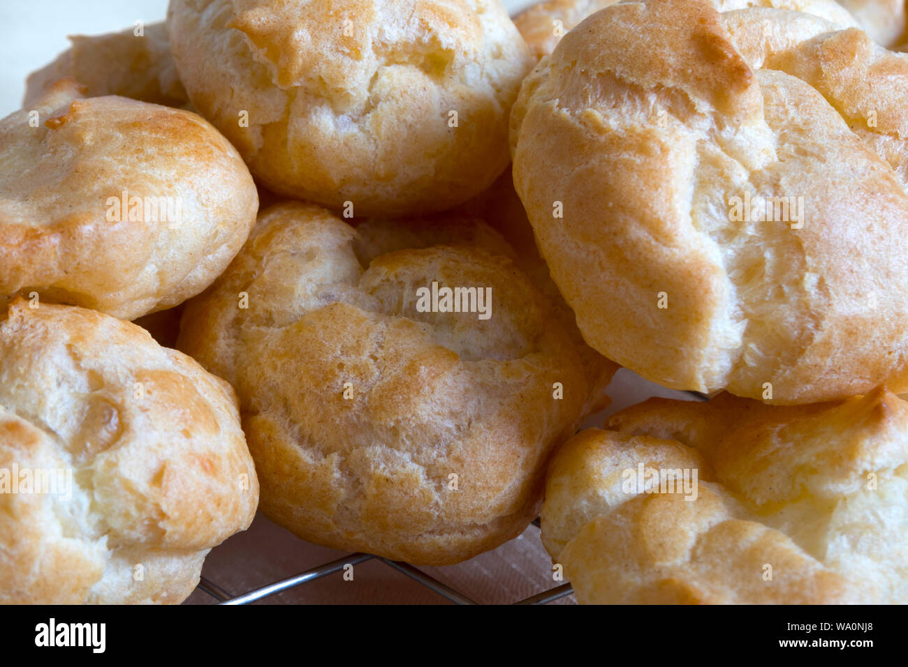 Delicious Choux Pastry Buns Cooling on a Rack Stock Photo - Alamy