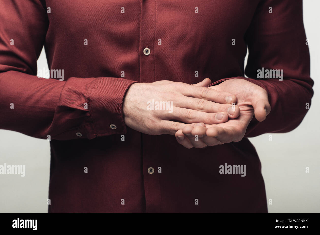 partial view of man clapping hands isolated on grey, human emotion and ...