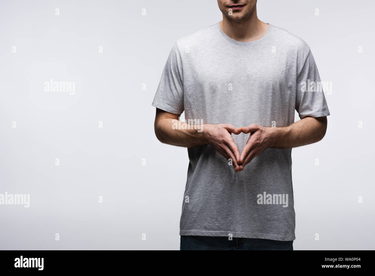partial view of man showing steeple gesture while using body language ...