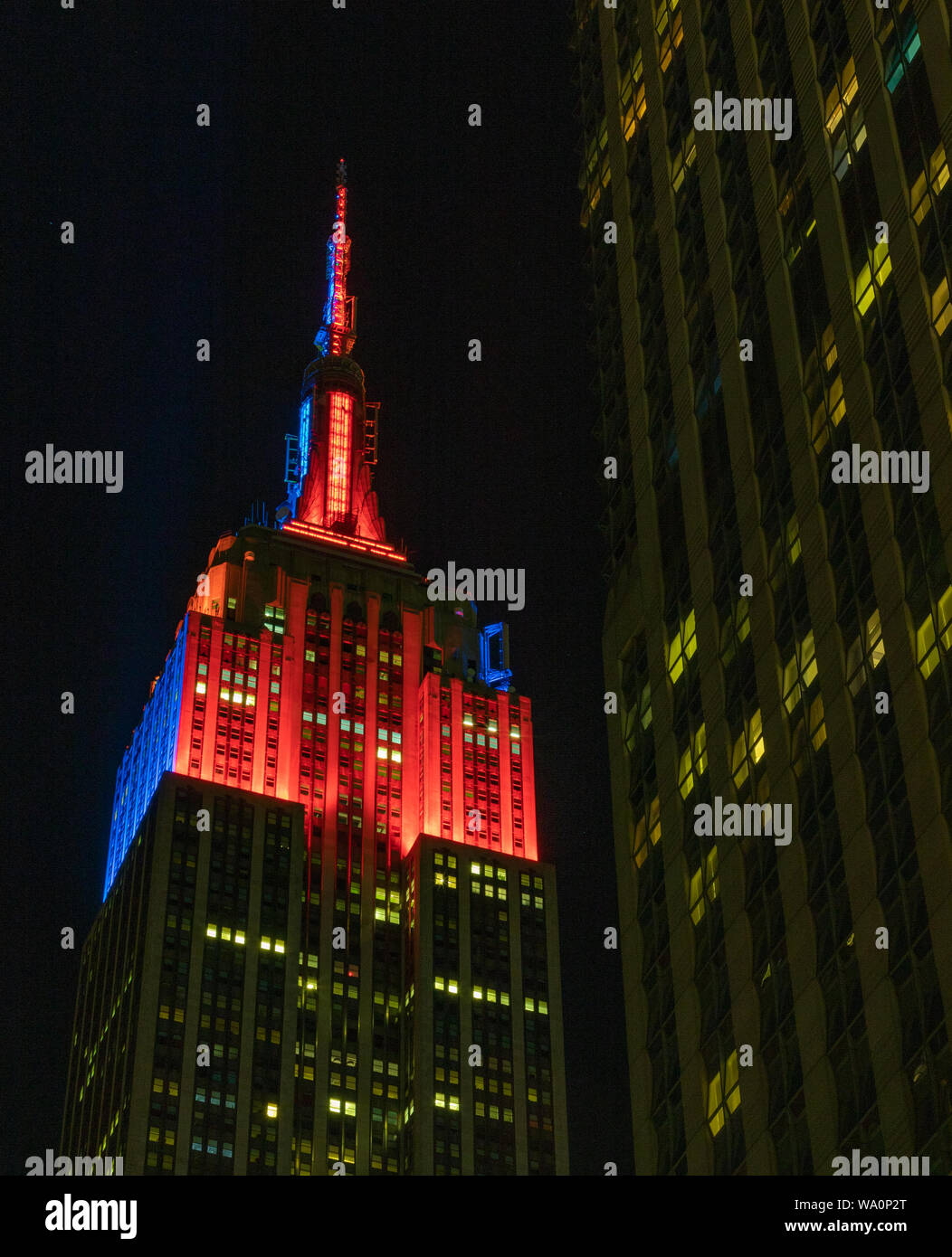 A picture of the Empire State Building illuminated at night Stock Photo ...