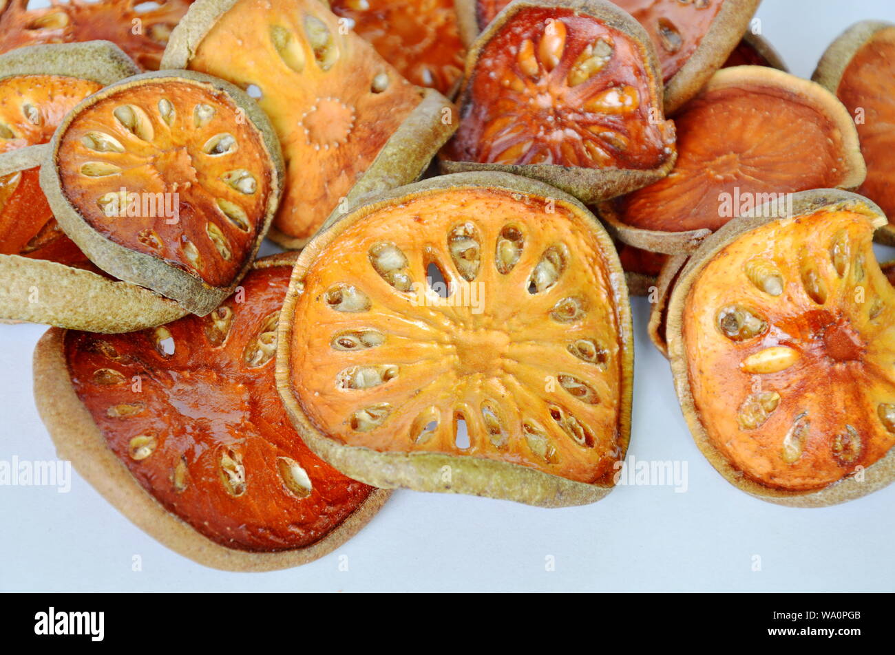 dry bael fruit on white background Stock Photo - Alamy