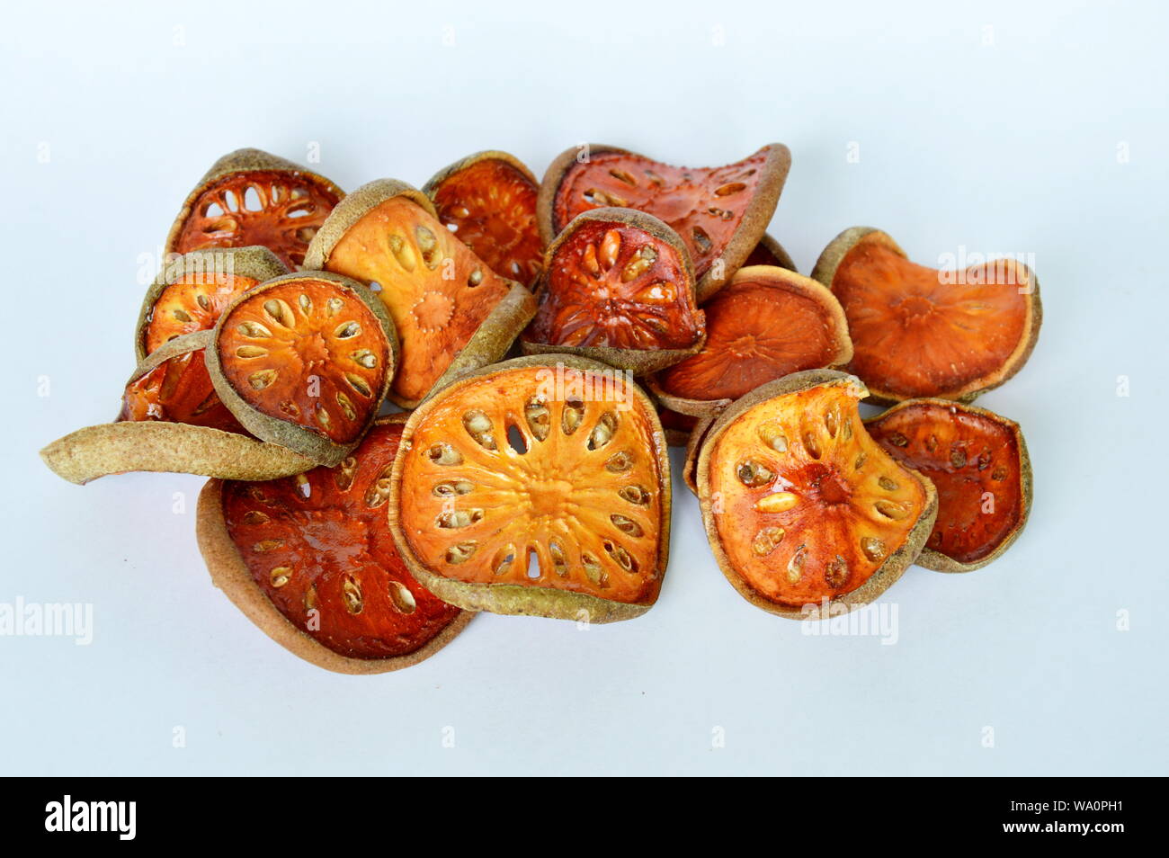 dry bael fruit on white background Stock Photo - Alamy