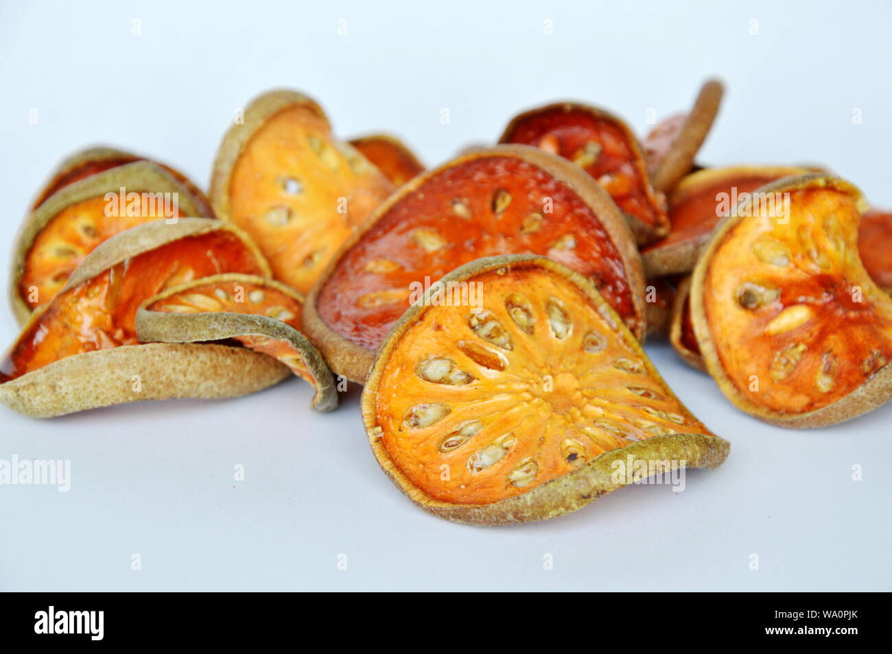 dry bael fruit on white background Stock Photo - Alamy