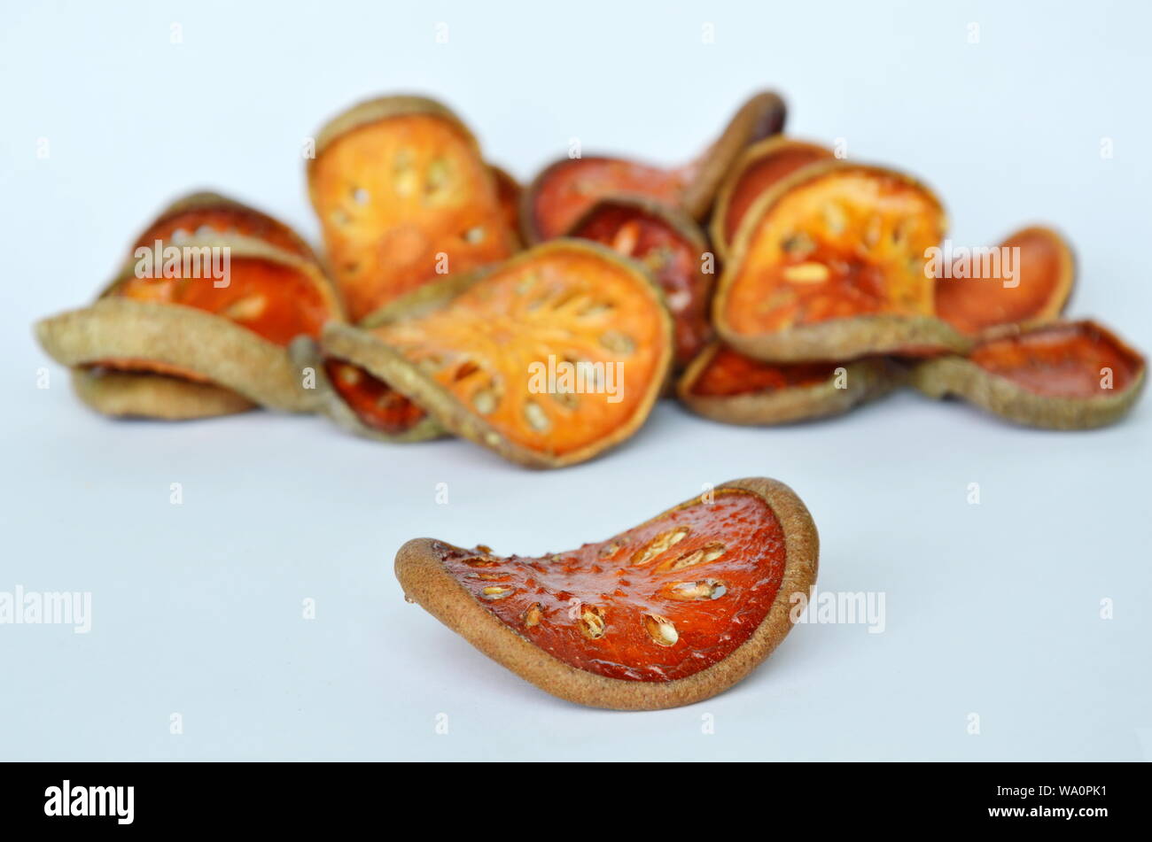dry bael fruit on white background Stock Photo - Alamy