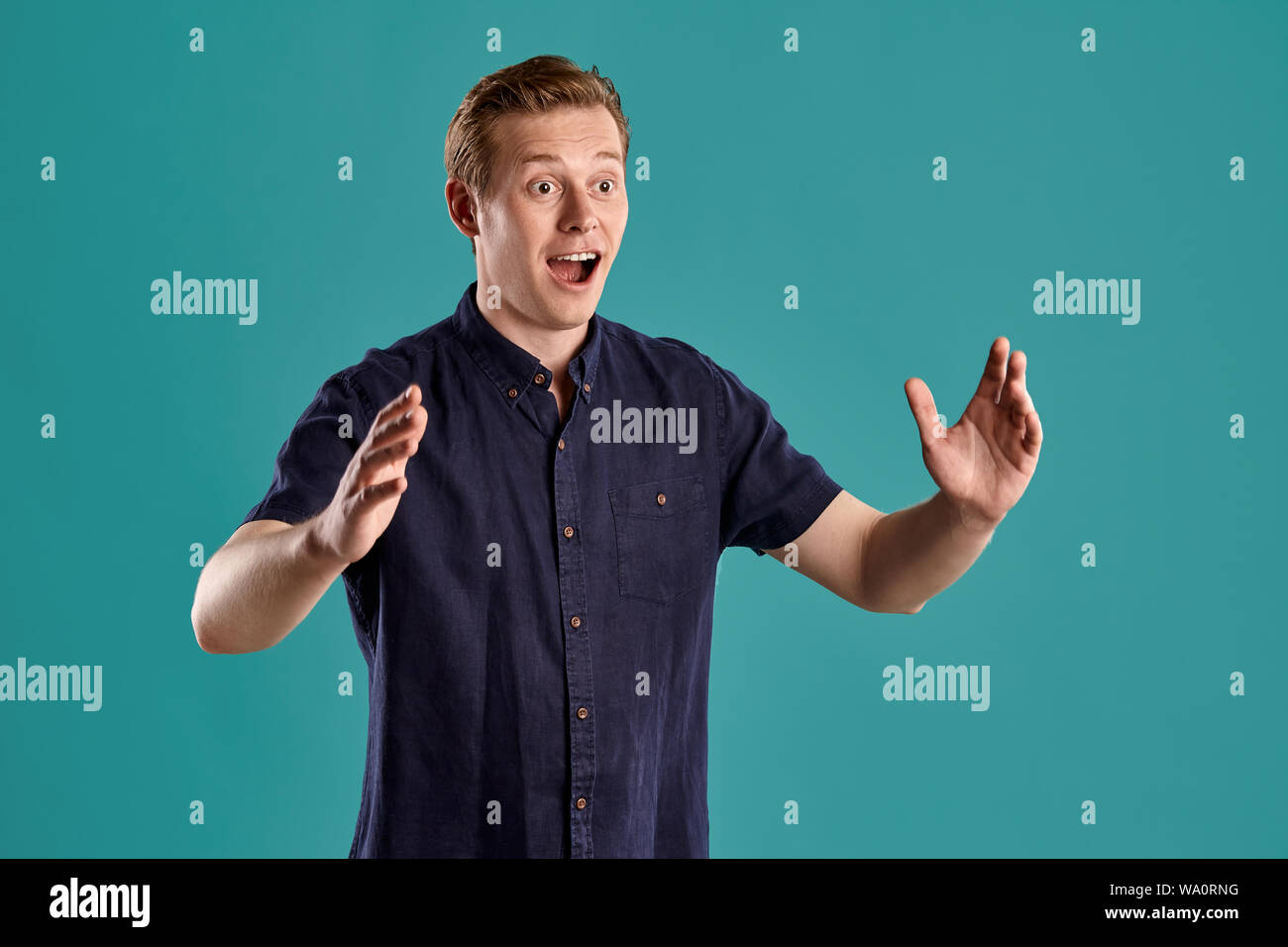 Close-up portrait of a young good-looking ginger man in a stylish navy ...