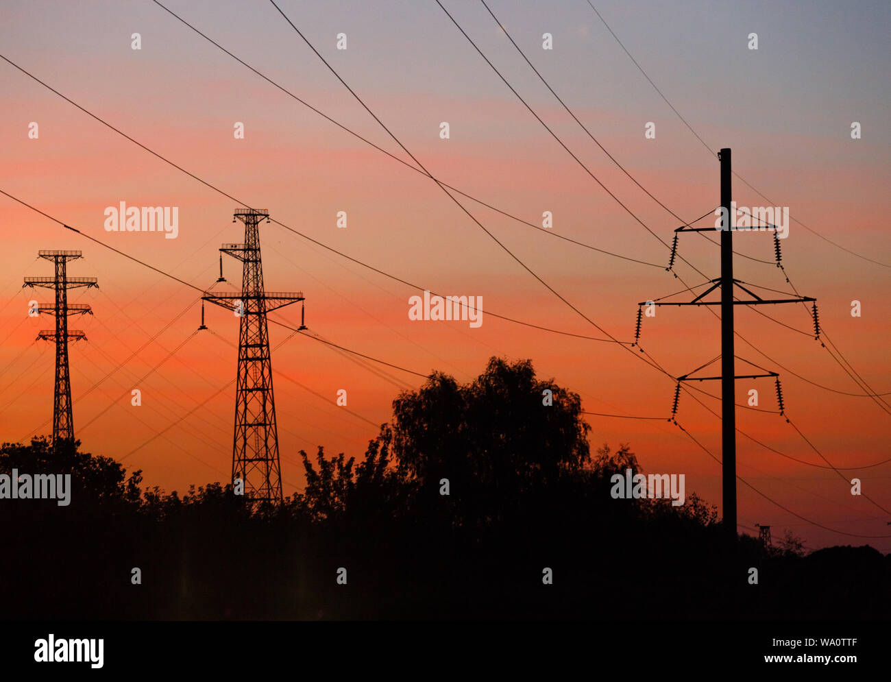 Electrical lines under a night sky with moon. power electric line and ...