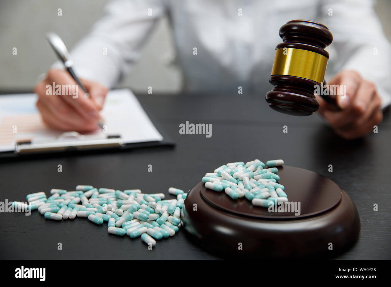 Medicine law concept. Judges gavel with pills close up Stock Photo - Alamy