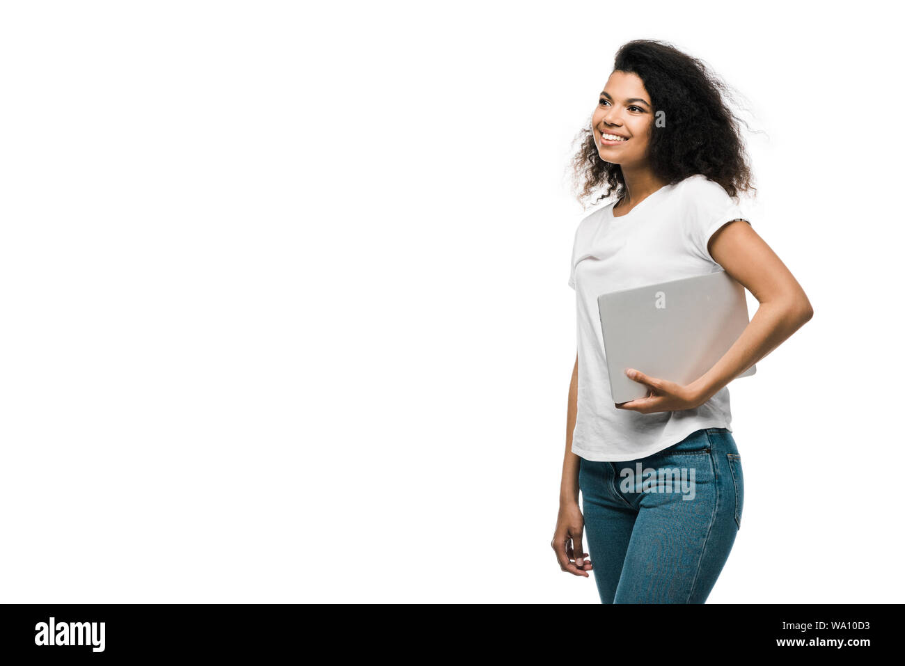 cheerful young african american woman holding laptop isolated on white ...