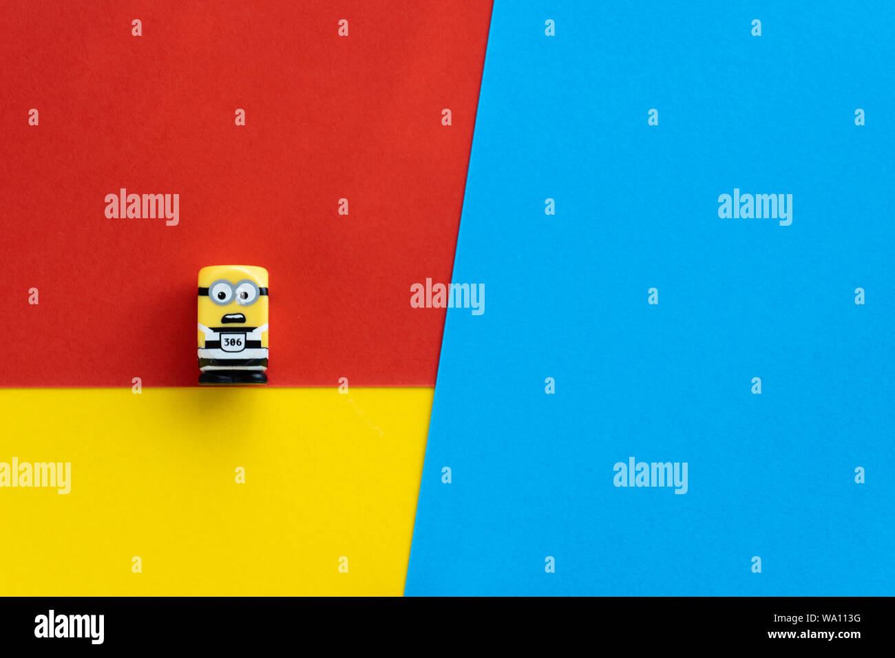 Milan, Italy - August 11 2019: Minion toy in prisoner's clothes with ...