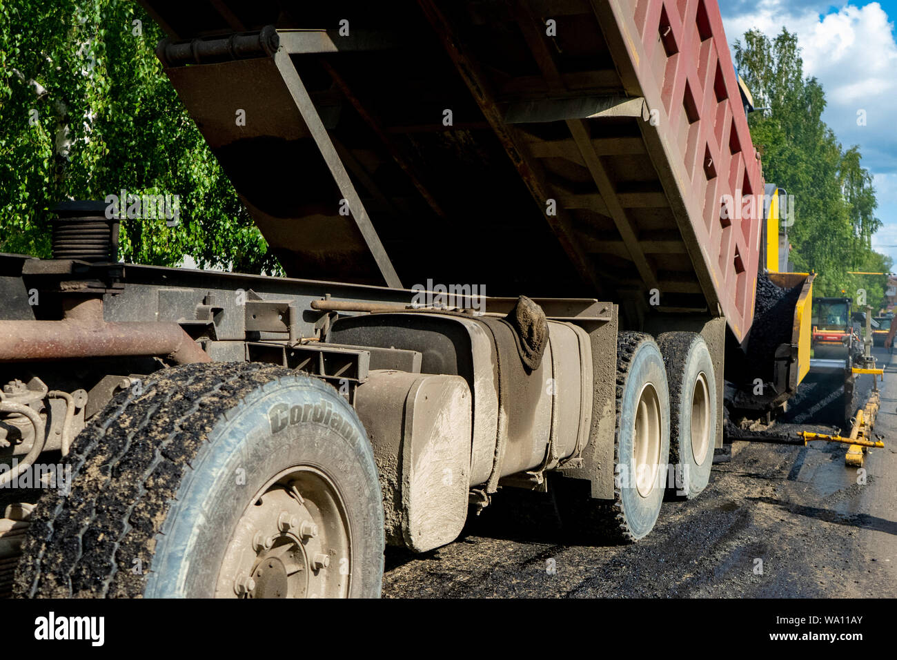 Chelyabinsk Region, Russia - August 2019. Loading hot asphalt. Road ...