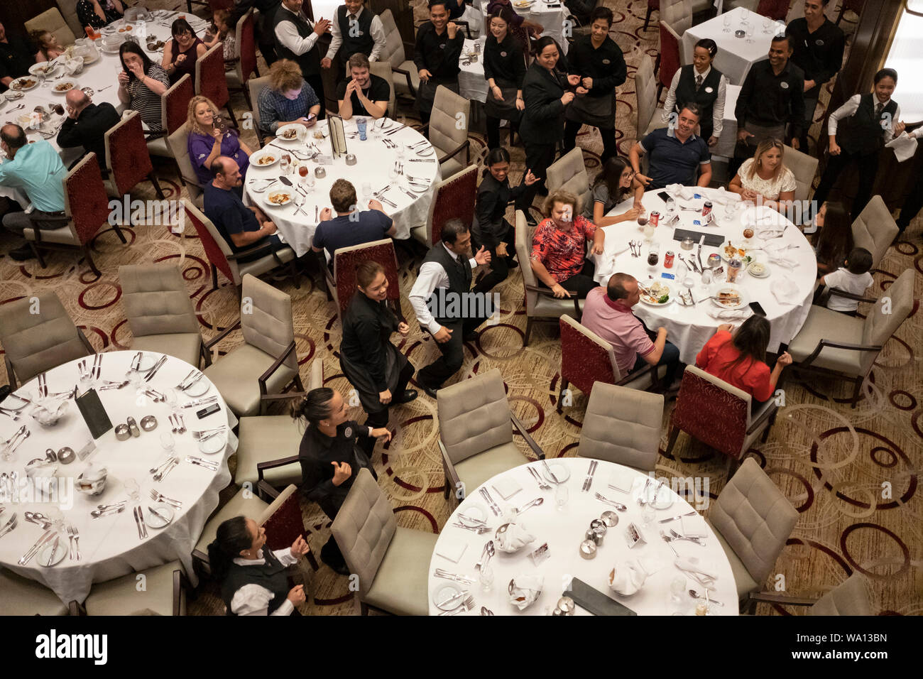 In the main 3-storey restaurant, about 50 waiters work there. Tonight ...