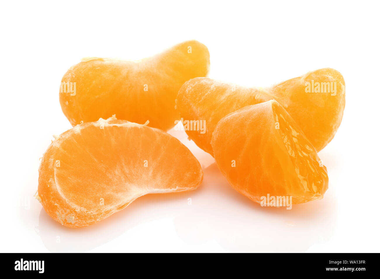 Fresh peeled tangerine slices isolated on white background Stock Photo ...