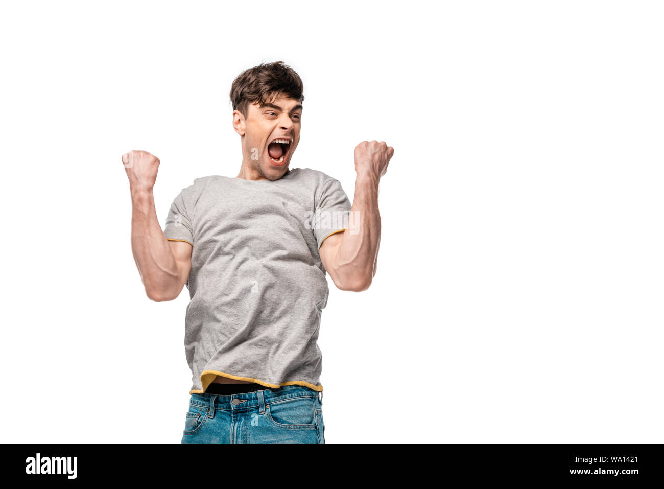 happy young man showing triumph gesture and screaming isolated on white ...