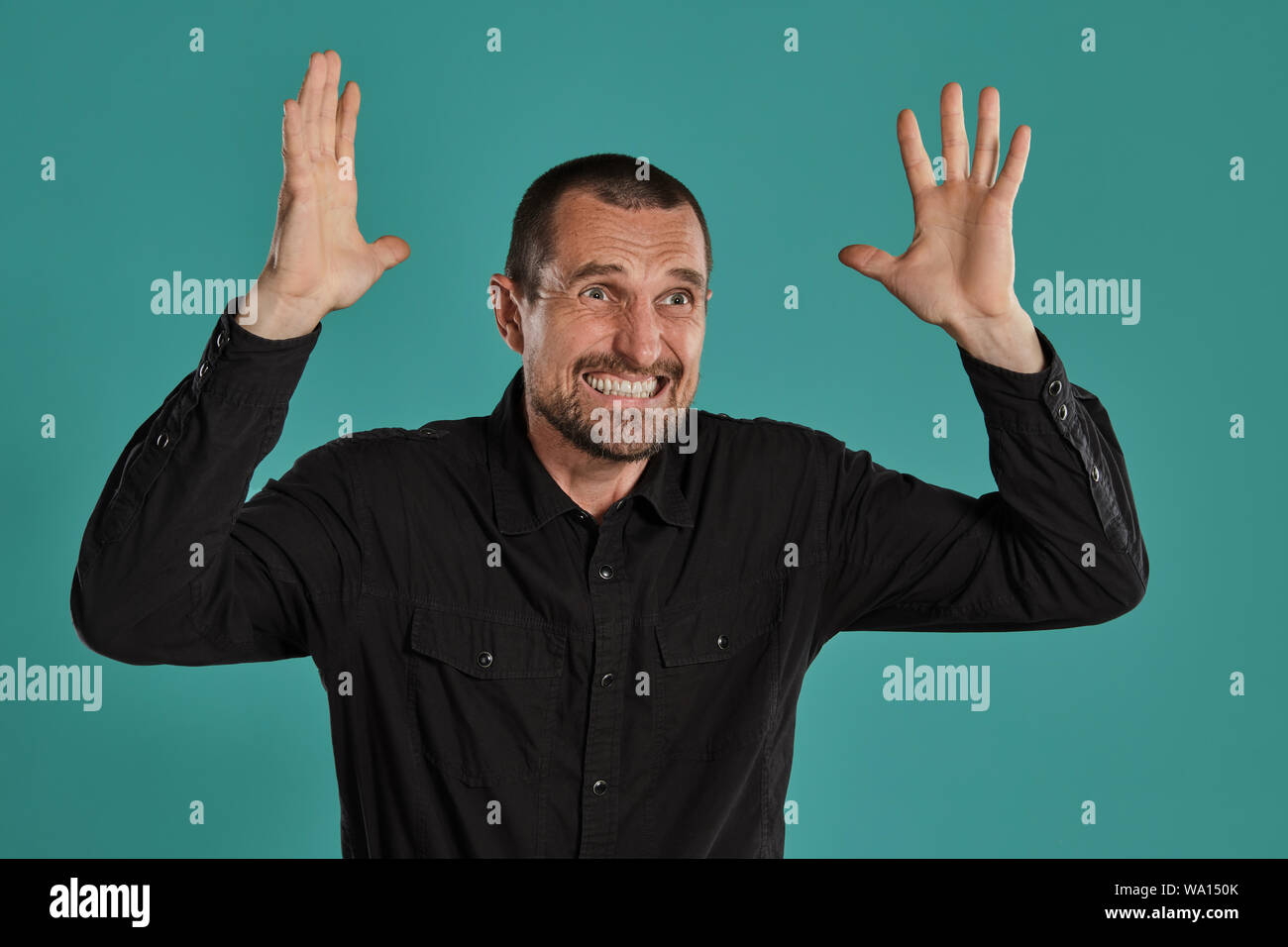 Close-up studio shot of a stately man with beard and mustache, wears ...