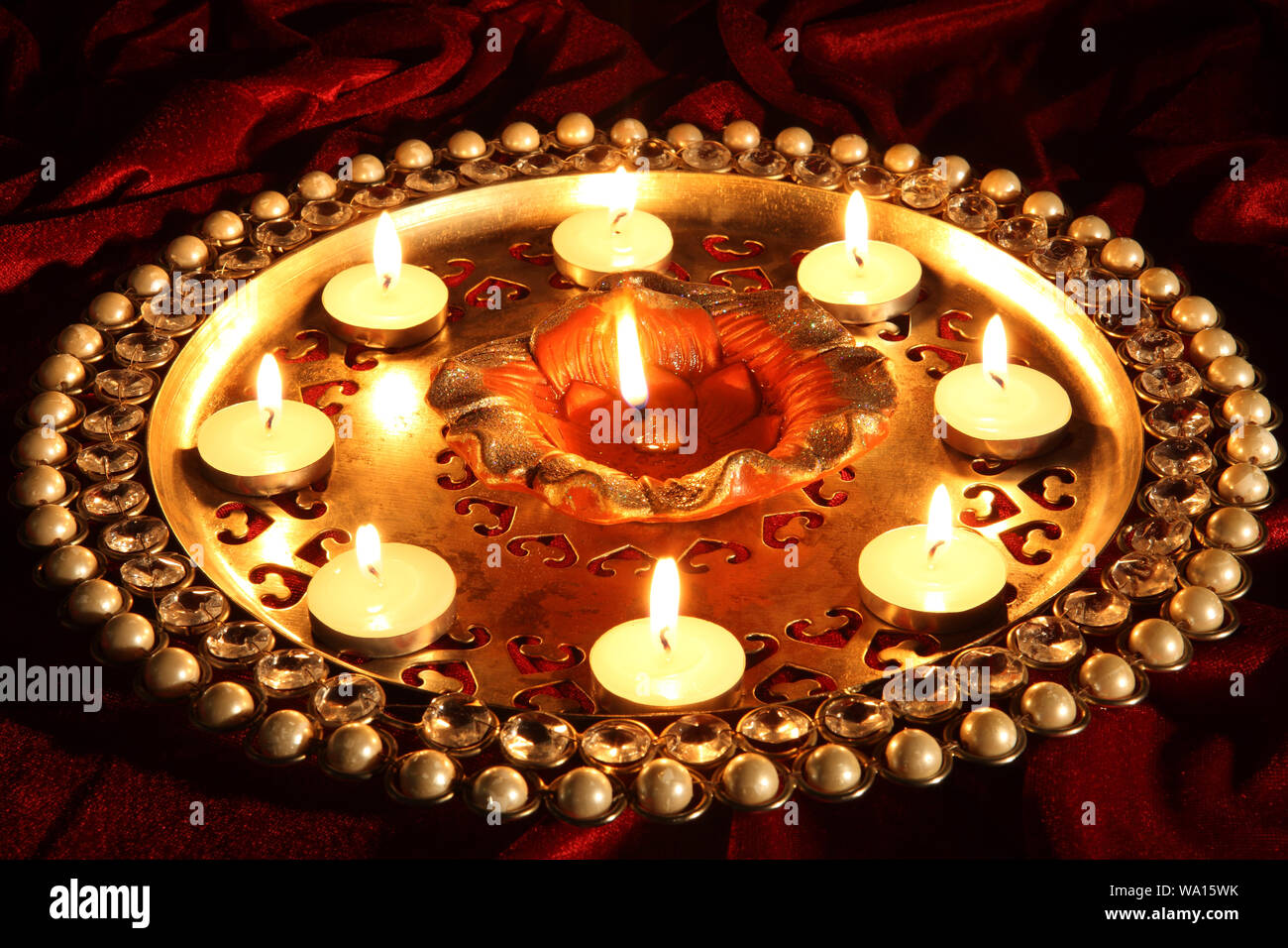 Indian people lighting diyas hi-res stock photography and images - Alamy