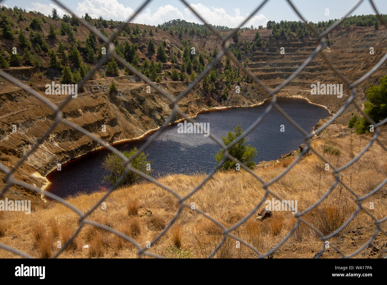 The Red Lake Behind The Fence Located At Mitsero Stock Photo - Alamy