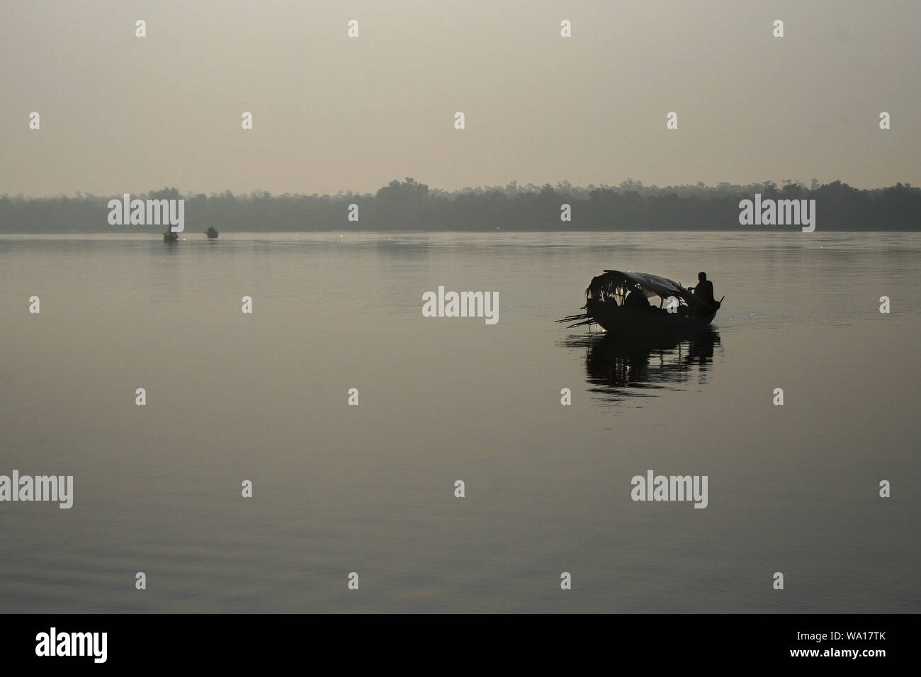 A fishing boat on the river in the Sundarbans. Bagerhat, Bangladesh ...