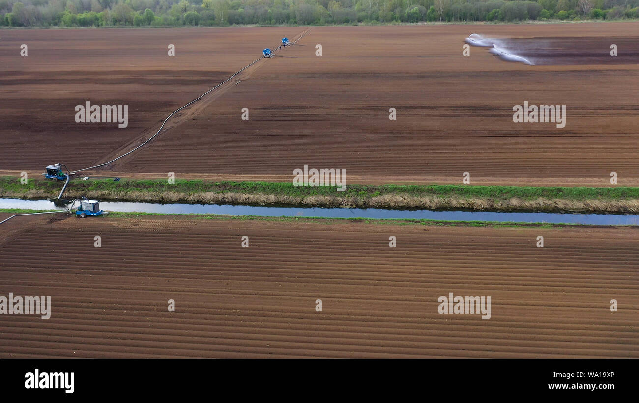 aerial view crop irrigation machine using center pivot sprinkler system ...