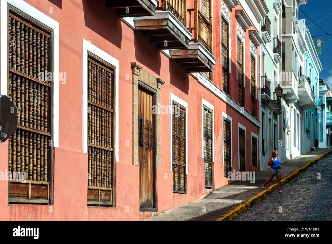 Woman and colorful buildings, Old San Juan, Puerto Rico Stock Photo - Alamy
