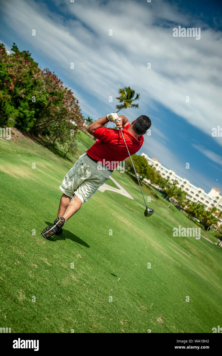 Golfer swinging, El Conquistador Golf Course, Fajardo, Puerto Rico ...