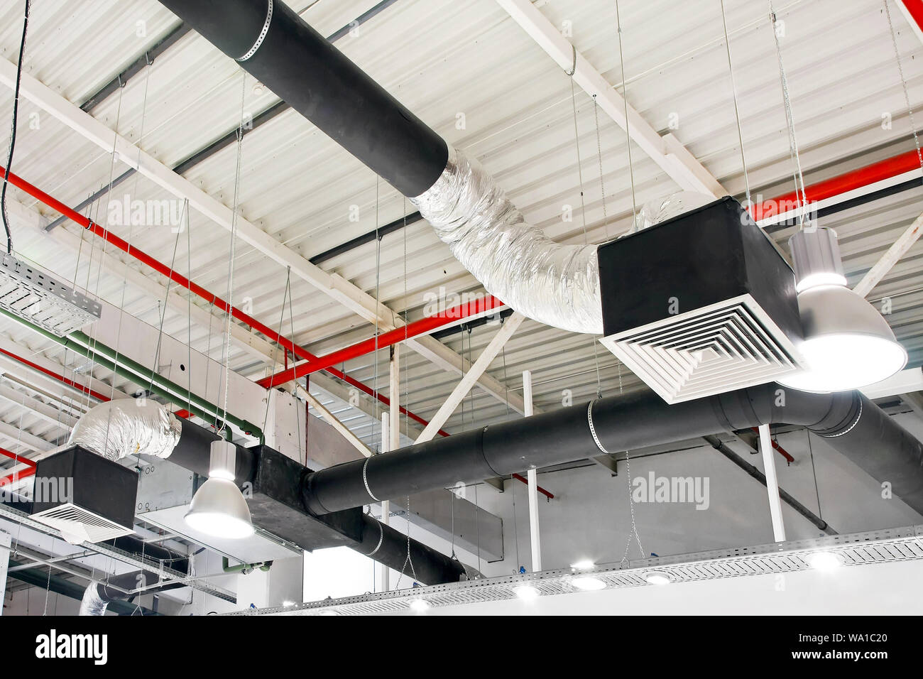 Industrial air duct ventilation equipment at ceiling Stock Photo - Alamy