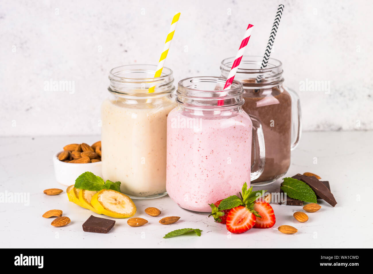 Banana, chocolate and strawberry milkshakes Stock Photo - Alamy