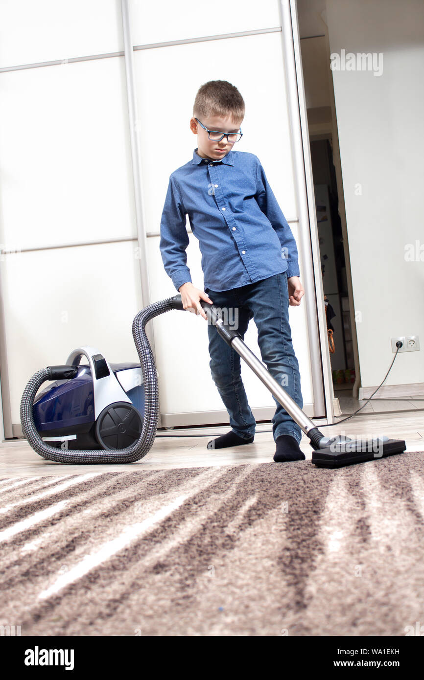 Boy cleaning vacuum cleaner hi-res stock photography and images - Alamy