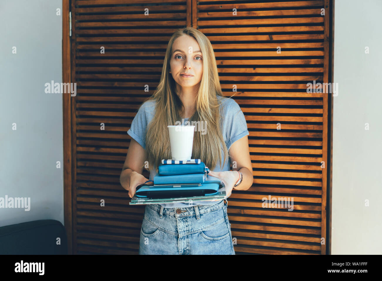Girl book stack pile teenager hi-res stock photography and images - Alamy