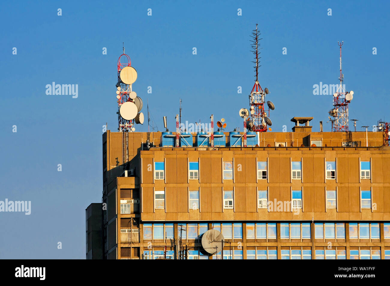 Communication tower building with antenna on top Stock Photo - Alamy