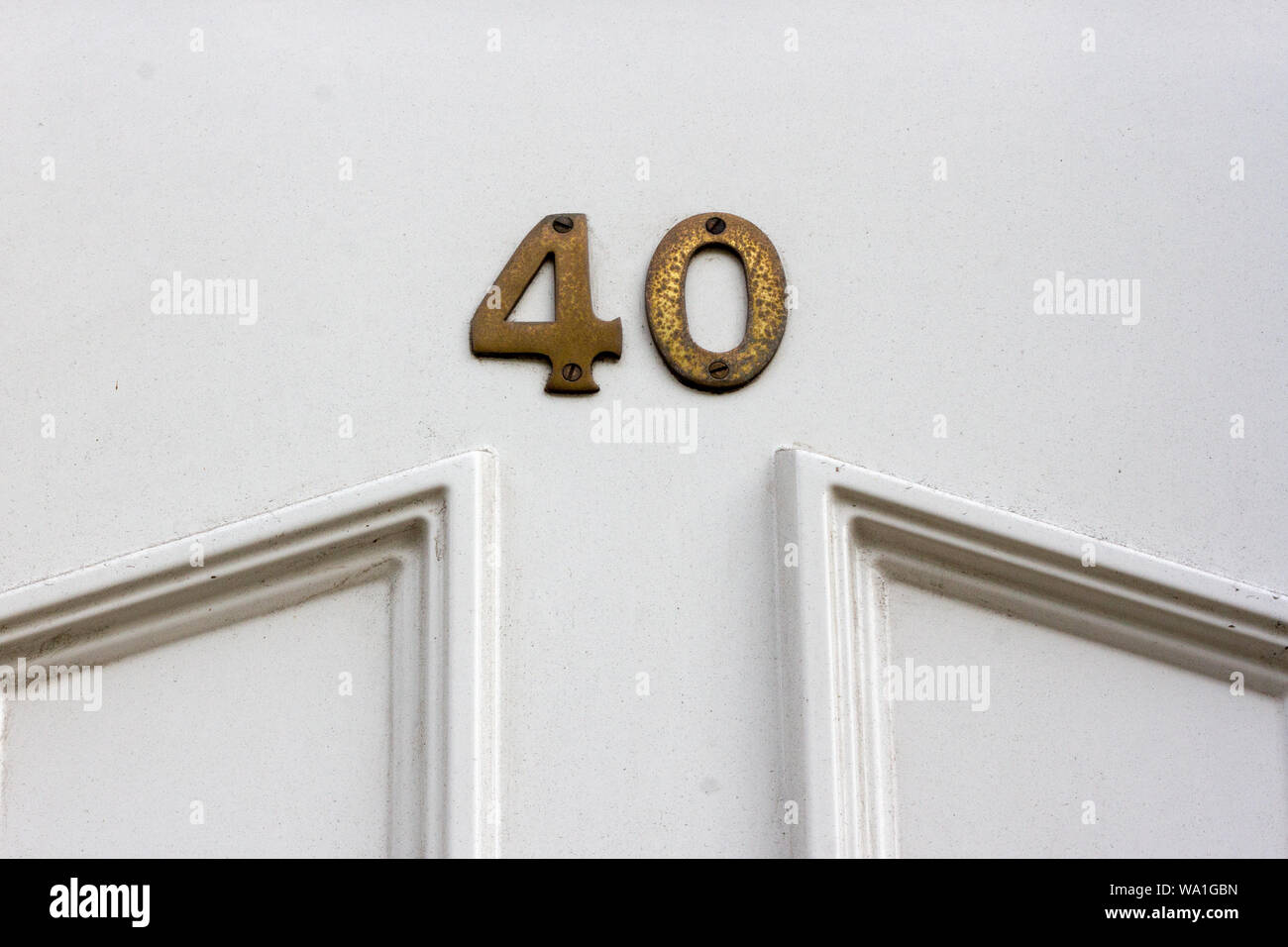House number 40 on a white front door Stock Photo - Alamy