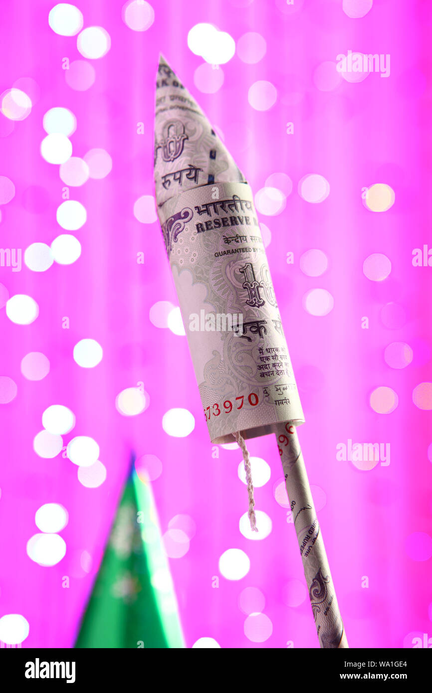 Diwali rocket made up of Indian banknotes Stock Photo - Alamy