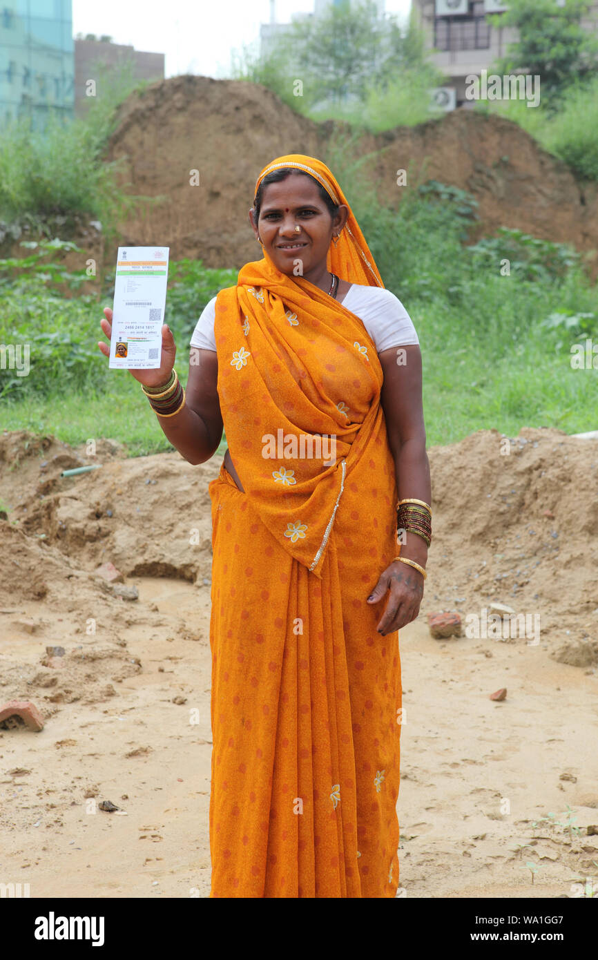 Rural woman showing an Aadhar card Stock Photo - Alamy