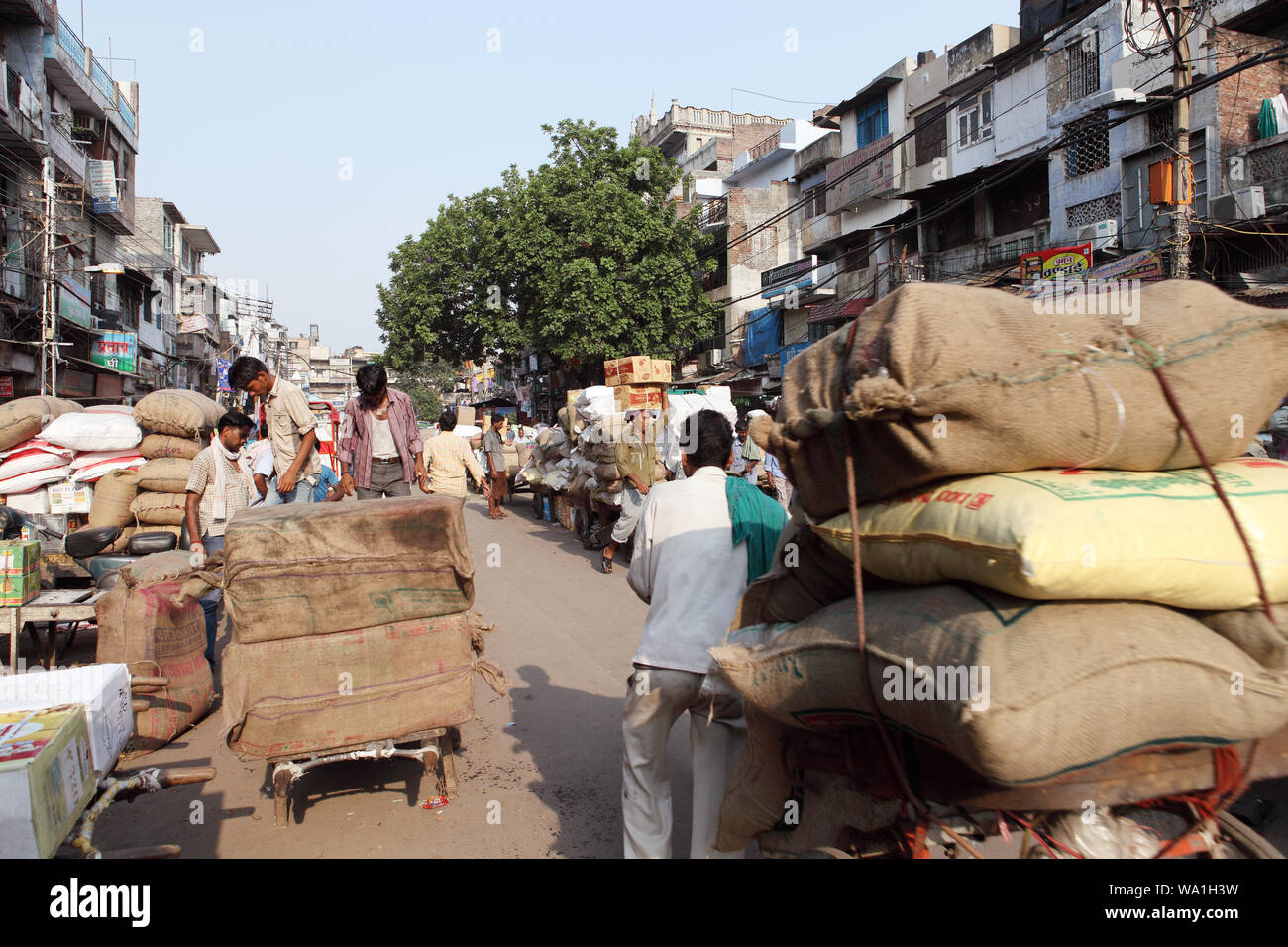 Delivery man pulling cart loaded hi-res stock photography and images ...