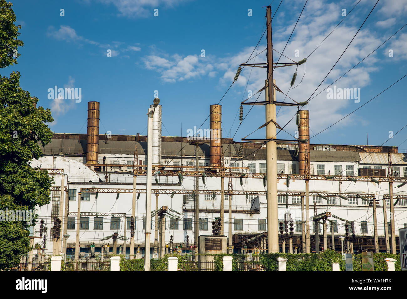 Industrial building with pipes. Shells of the plant.Industrial building ...