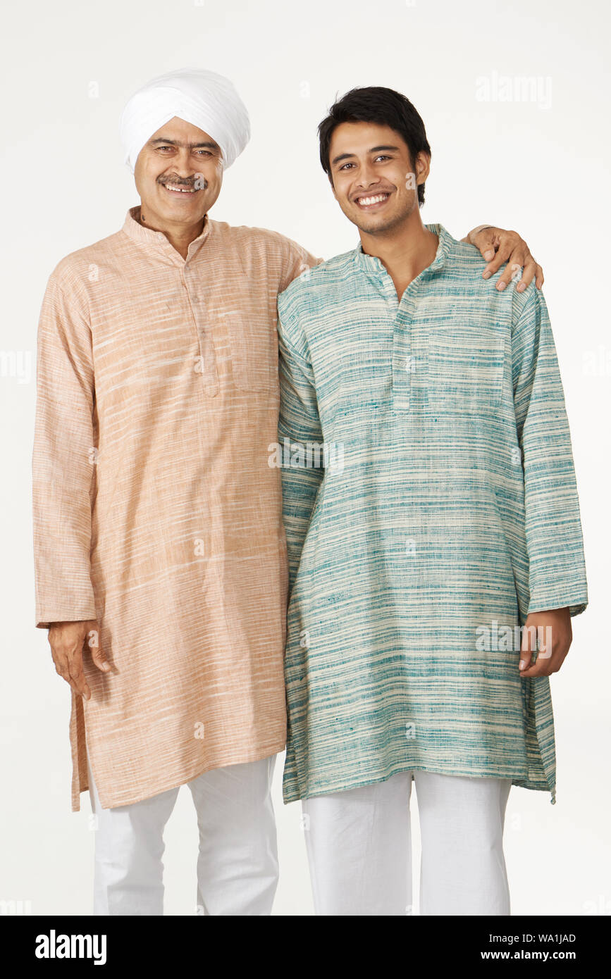 Old man smiling with his adult son standing together Stock Photo - Alamy
