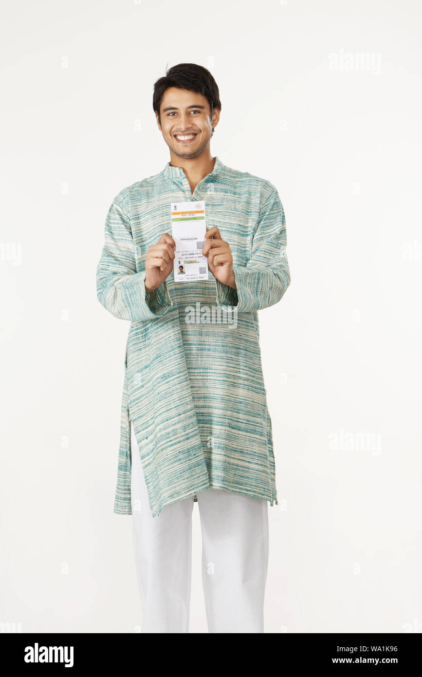 Rural man showing an Aadhar card and smiling Stock Photo - Alamy