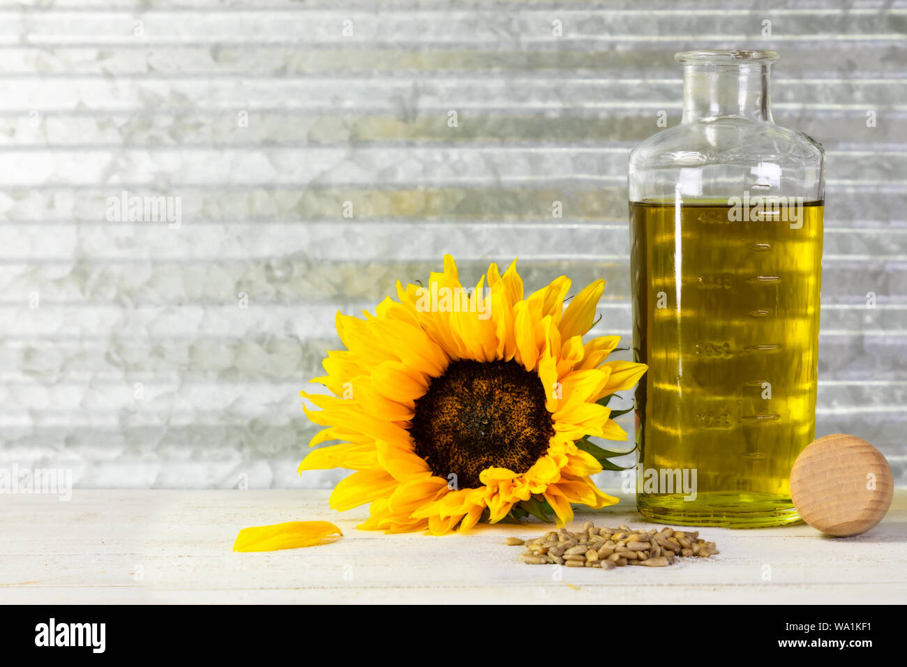 Sunflower, oil in a bottle and seeds. Copy space Stock Photo - Alamy