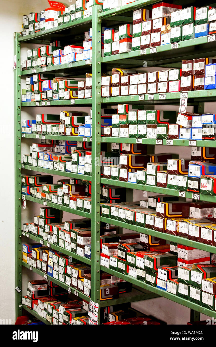 Big shelf with lot boxes and goods Stock Photo - Alamy